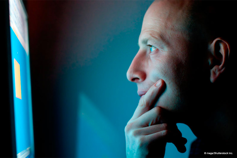 man staring intently at a computer screen card | National Institute of ...
